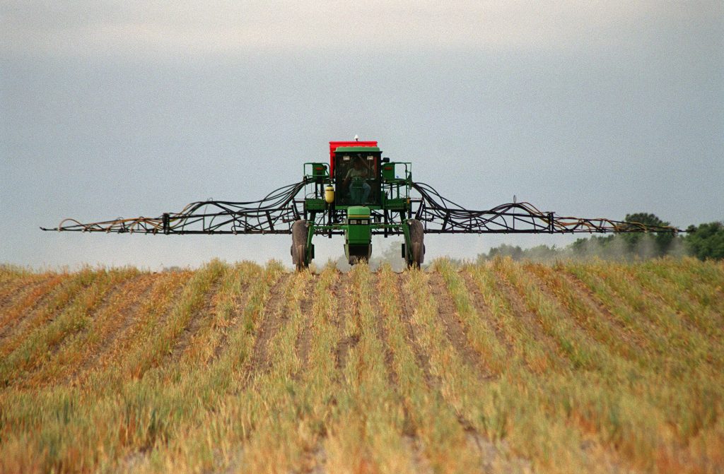 Farm equipment spraying the fields. | Panhandle Agriculture